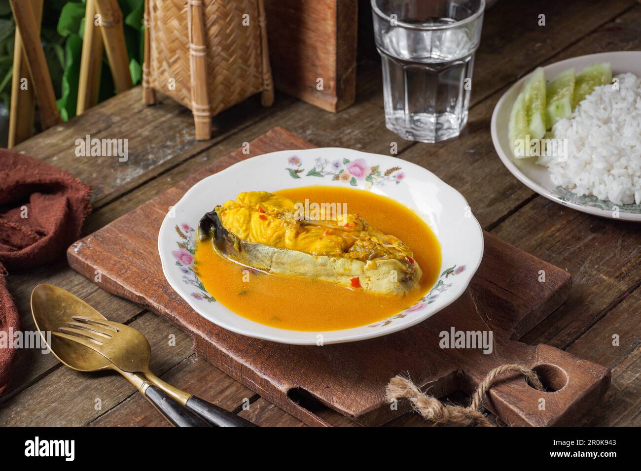 Silver catfish cooked with spicy coconut milk and fermented durian. A ...