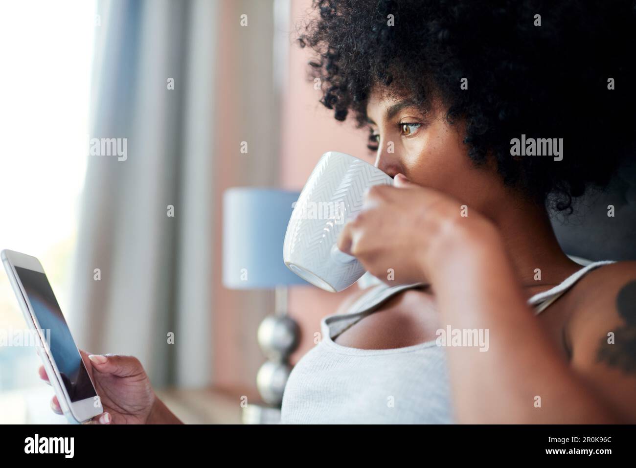 People are always spilling some tea on social media. a woman using her ...