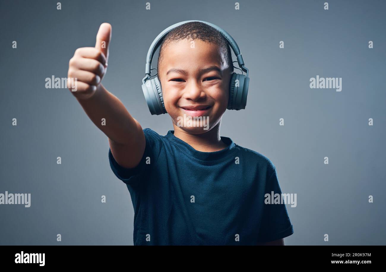 The best beats for a boy like me. Studio shot of a cute little boy ...