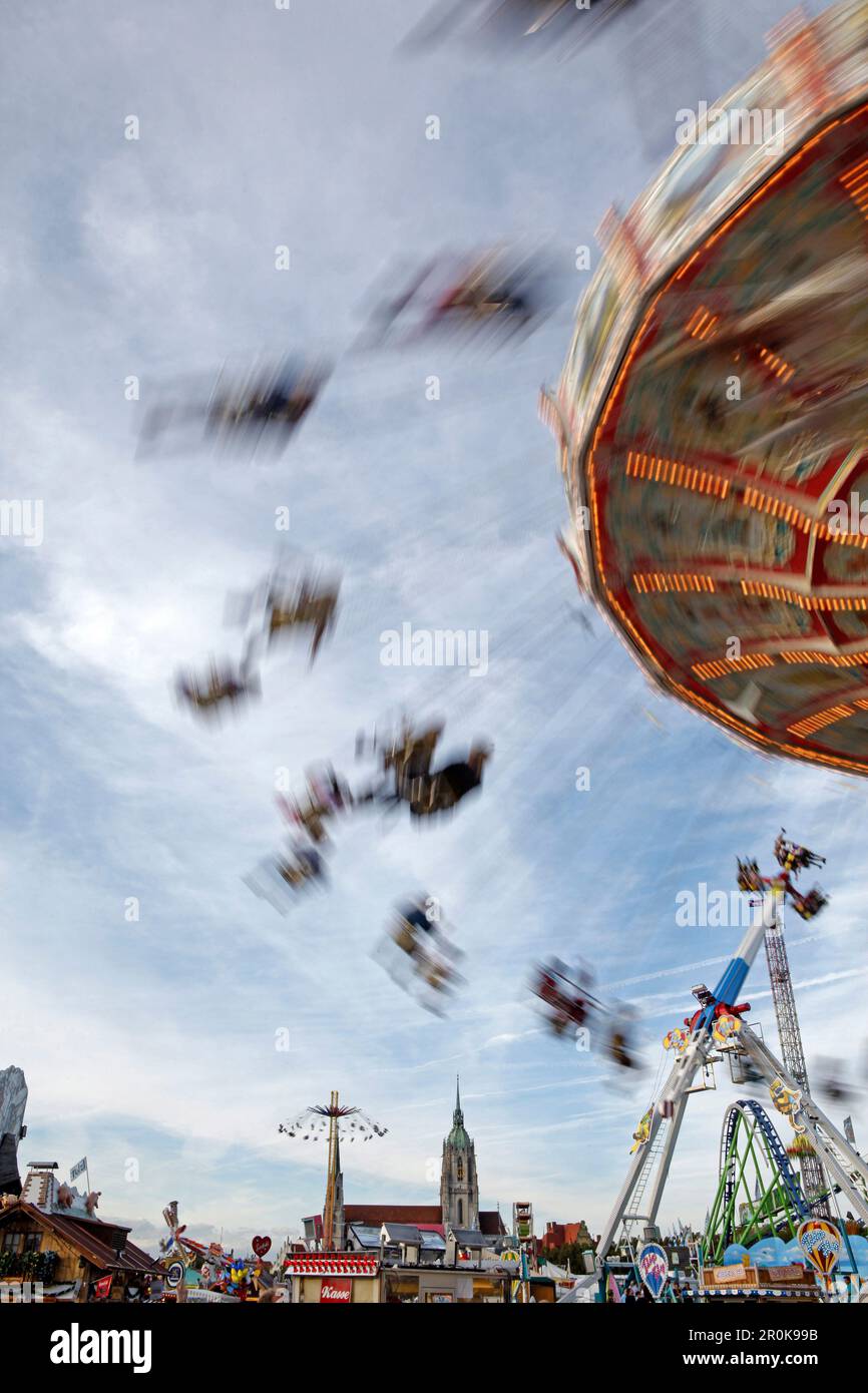 Chairoplane at the Oktoberfest, Church of St. Paul in the background ...