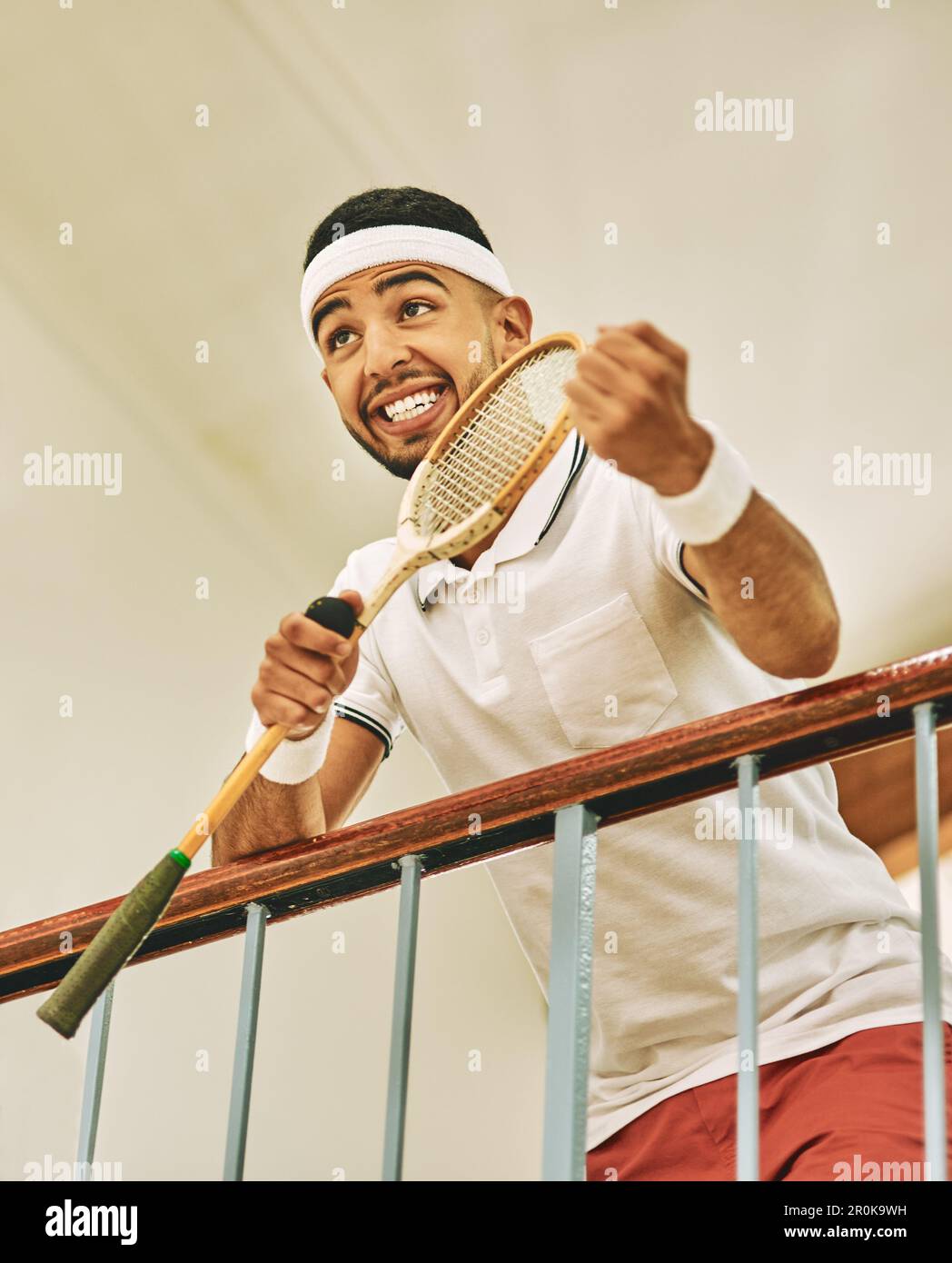 A keen eye for squash. a young man watching a game of squash from the ...