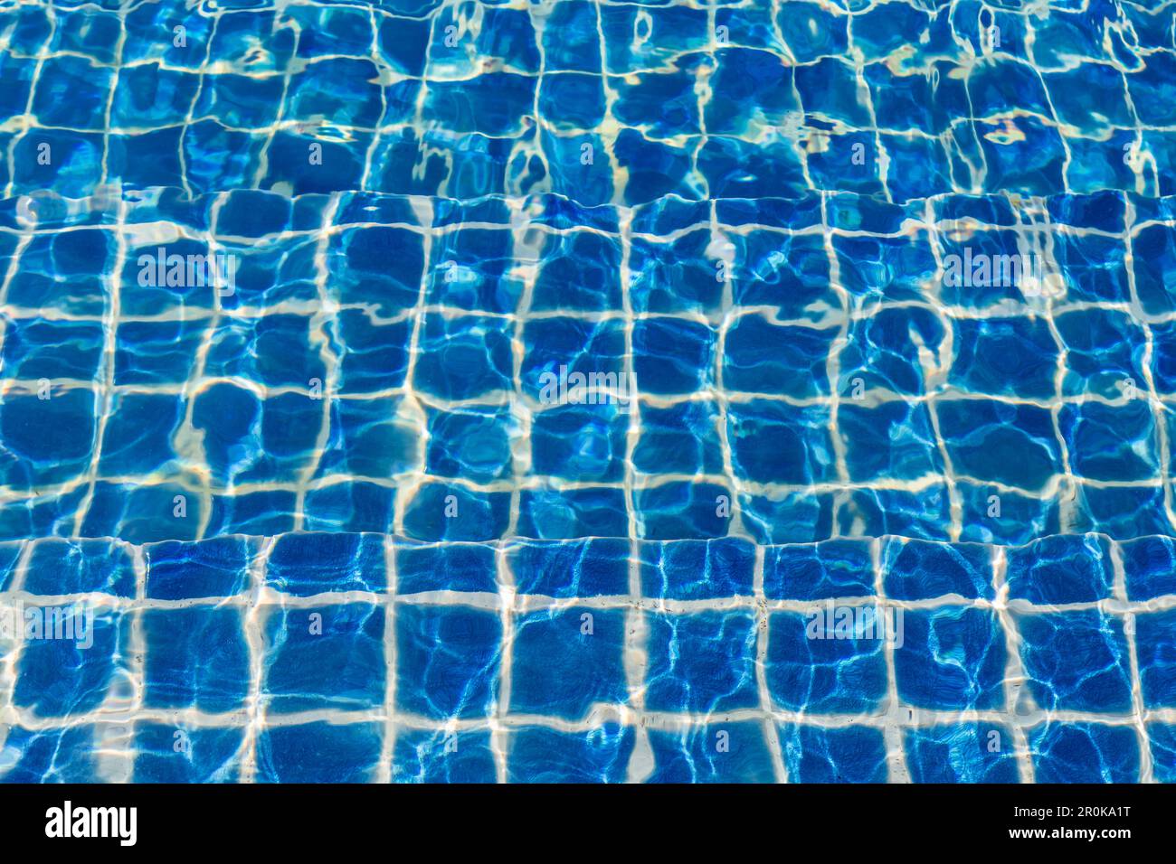 Blue color water in swimming pool rippled background Stock Photo - Alamy