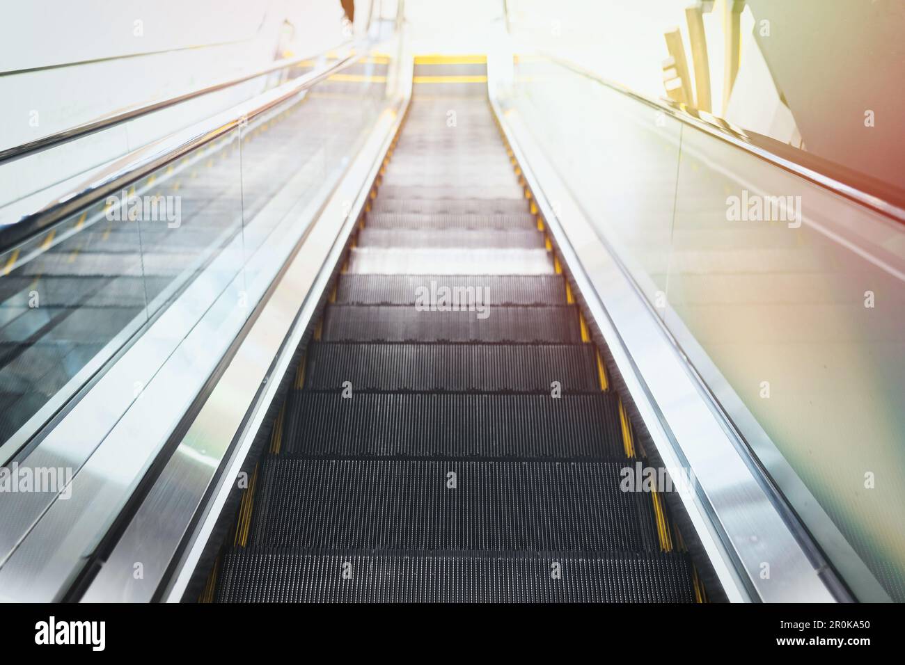 Moving stairway on escalator in interior of a public place Stock Photo ...