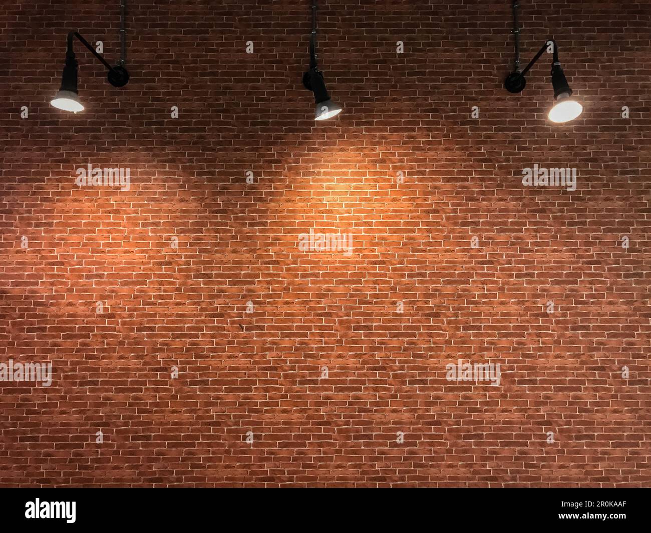 Spot light and brick background Stock Photo - Alamy