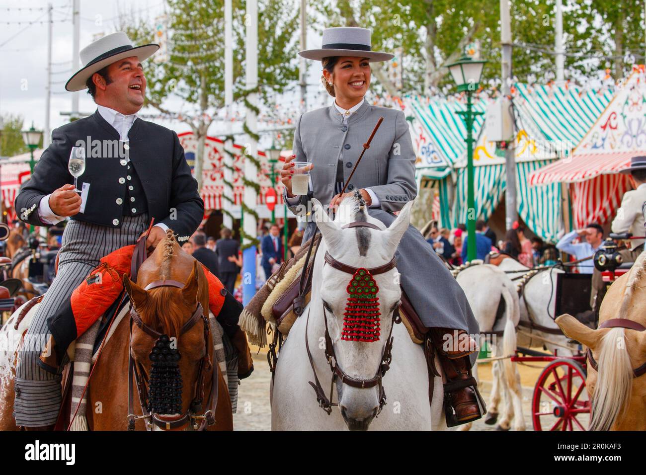 horseriding couple on horseback, Feria de Abril, Seville Fair, spring ...