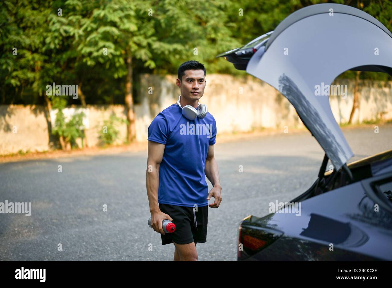 Man standing behind car hi-res stock photography and images - Alamy