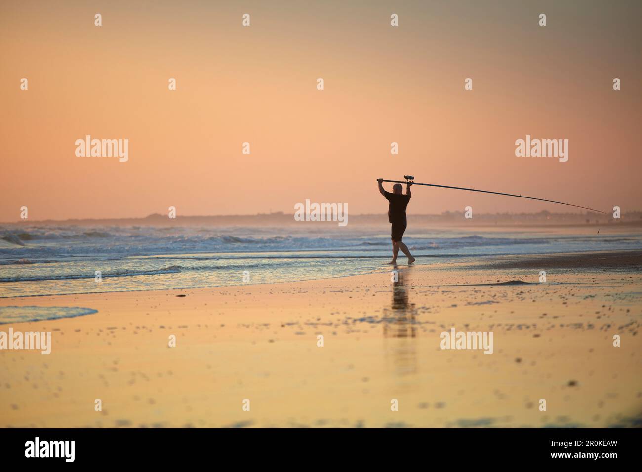 fishing man on the beach, roche beach, andalusia, southwest coast spain ...