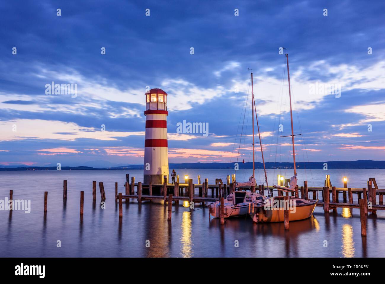 Lighthouse and sailing boats at night, Podersdorf, lake Neusiedl ...