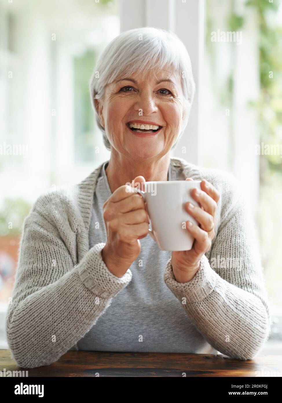 Portrait, happy old woman and drinking coffee in home for break ...