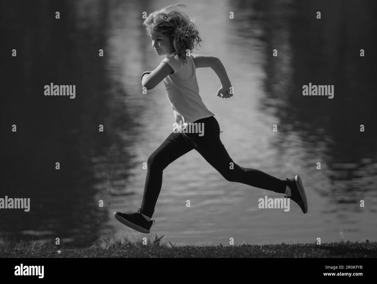 Kids jogging in park outdoor. Little boy running in nature. Run ...