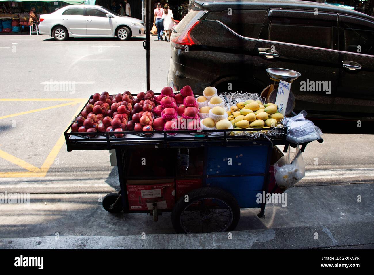 Thai merchant vendor sale variety tropical fruits shop on hawker cart ...
