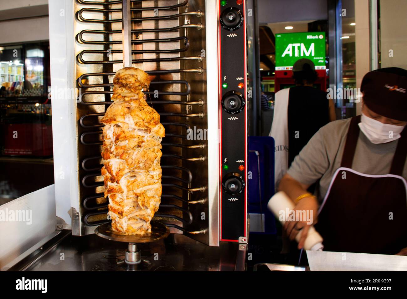 Thai merchant vendor cooking grilled roasted meat turkish food kebab or ...