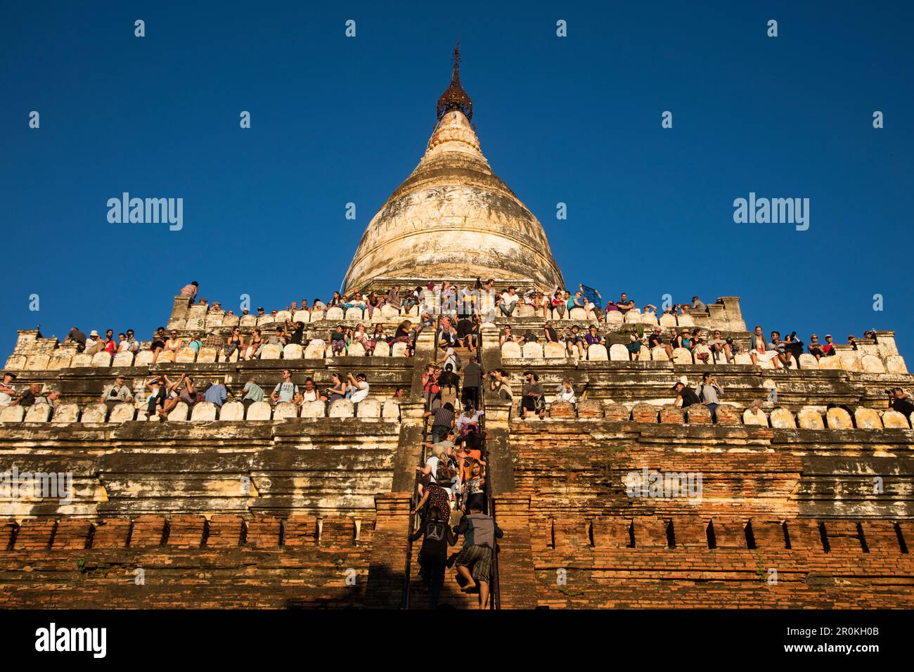 People crowd terraces of Shwesandaw Pagoda to watch the sunset, Bagan ...