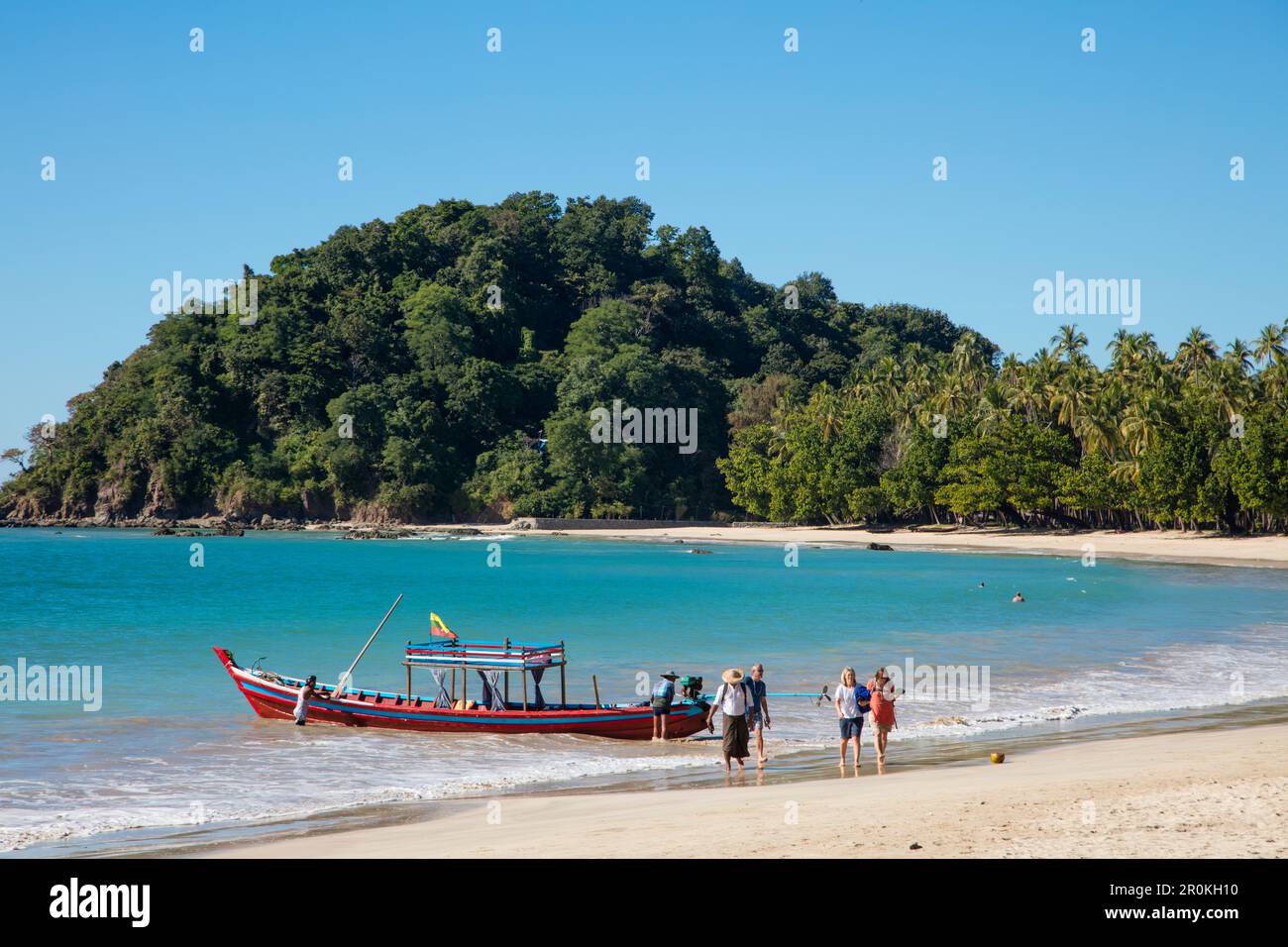People disembark from boat after excursion to Maung Shwe Lay village ...