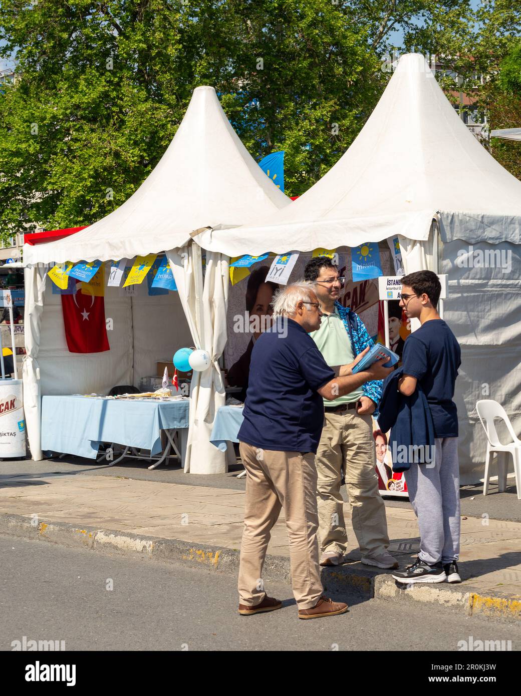 Istanbul, Turkey - May 7 2023: Volunteer hand out flyers in front of an ...