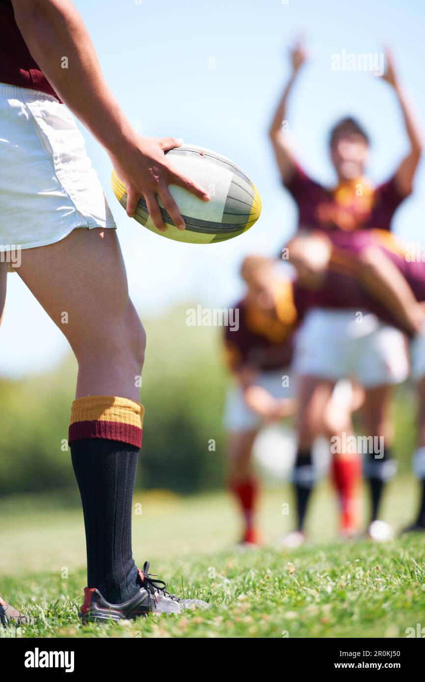 Rugby, closeup and man with a ball in hand outdoor on a pitch for ...