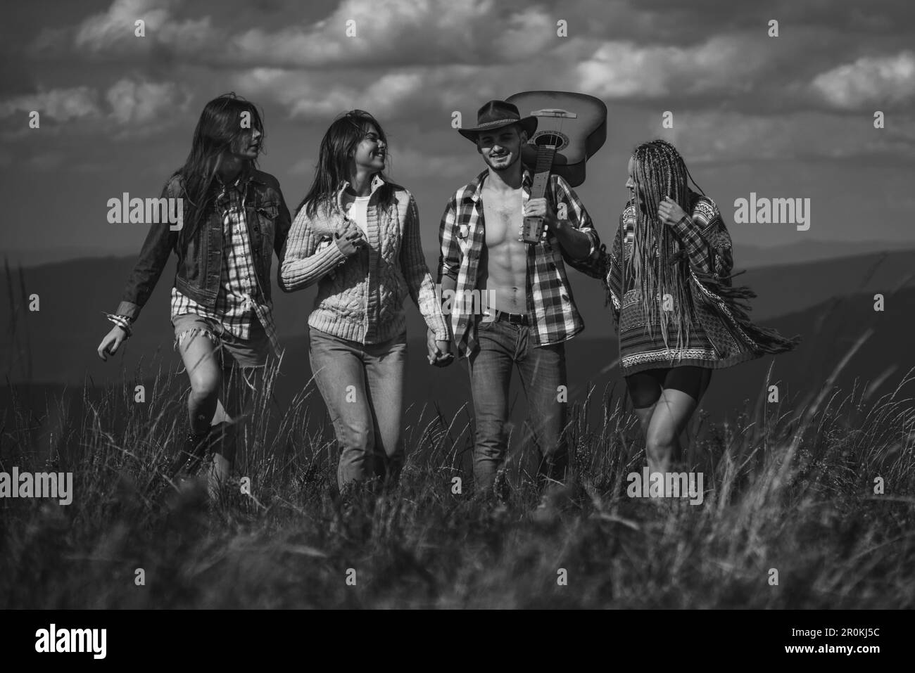 Young friends walking on country Black and White Stock Photos & Images ...