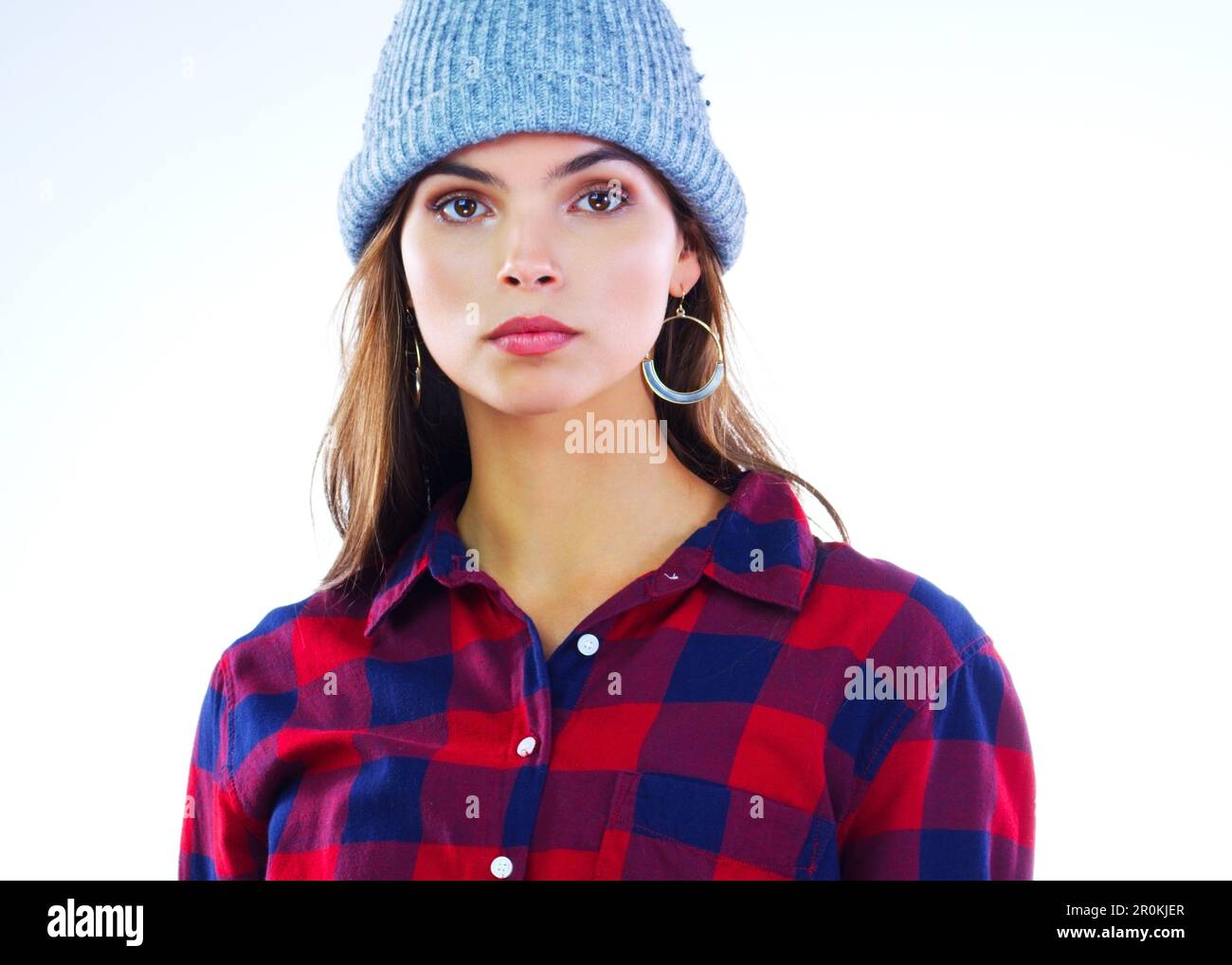 Its hard to read her expressions. a young woman posing against a white ...