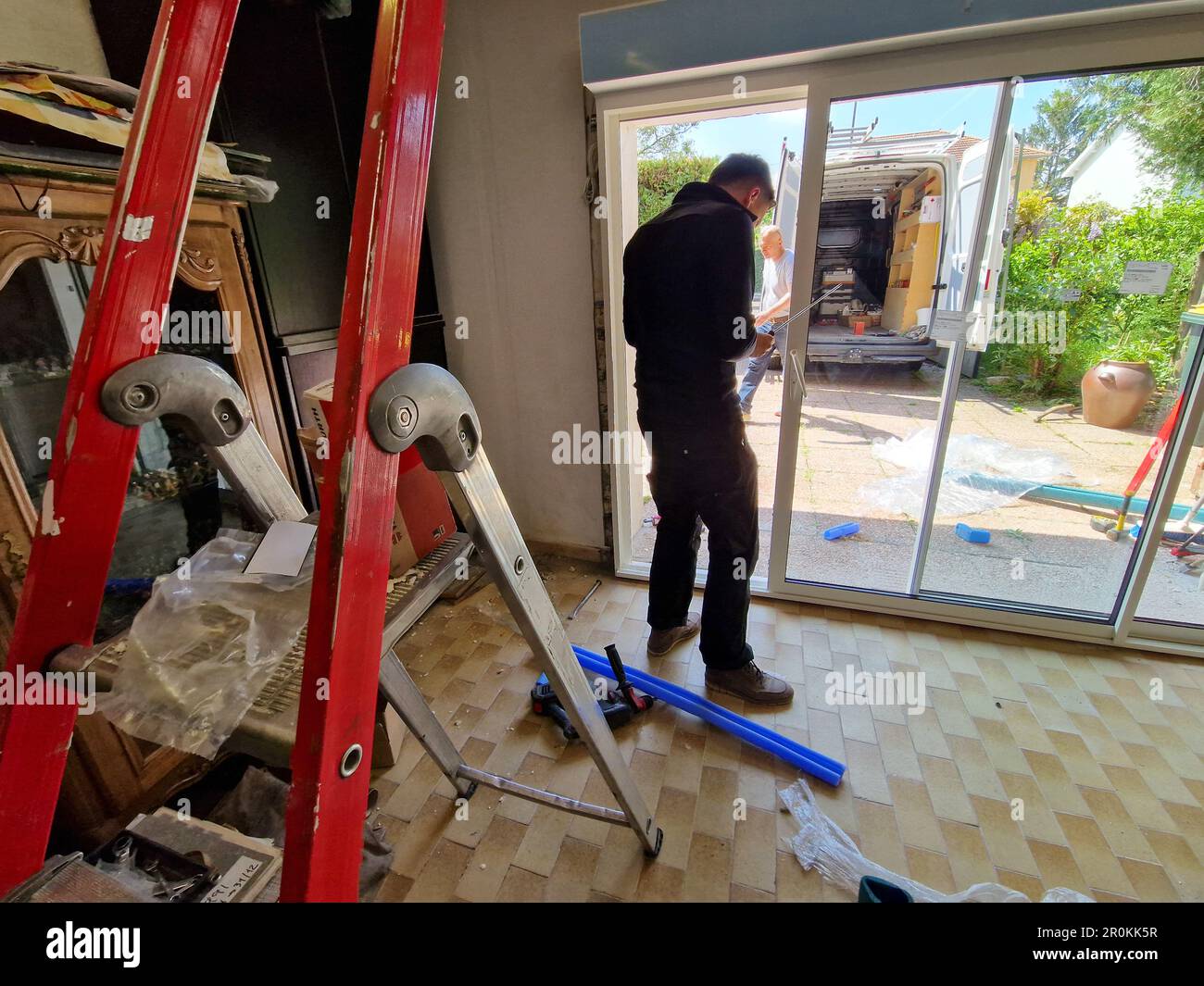 Interior fittings, craftmen setting up a glass window, Bron, France ...