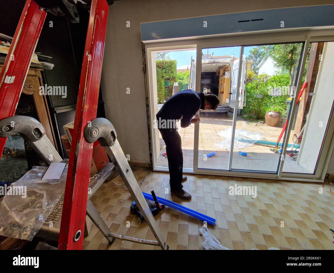 Interior fittings, craftmen setting up a glass window, Bron, France ...