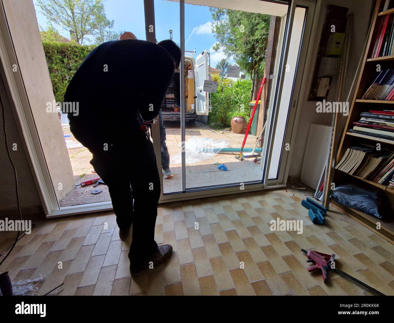 Interior fittings, craftmen setting up a glass window, Bron, France ...