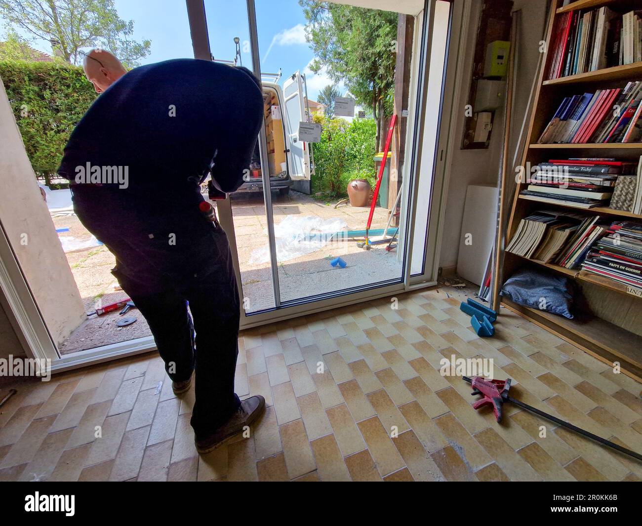 Interior fittings, craftmen setting up a glass window, Bron, France ...