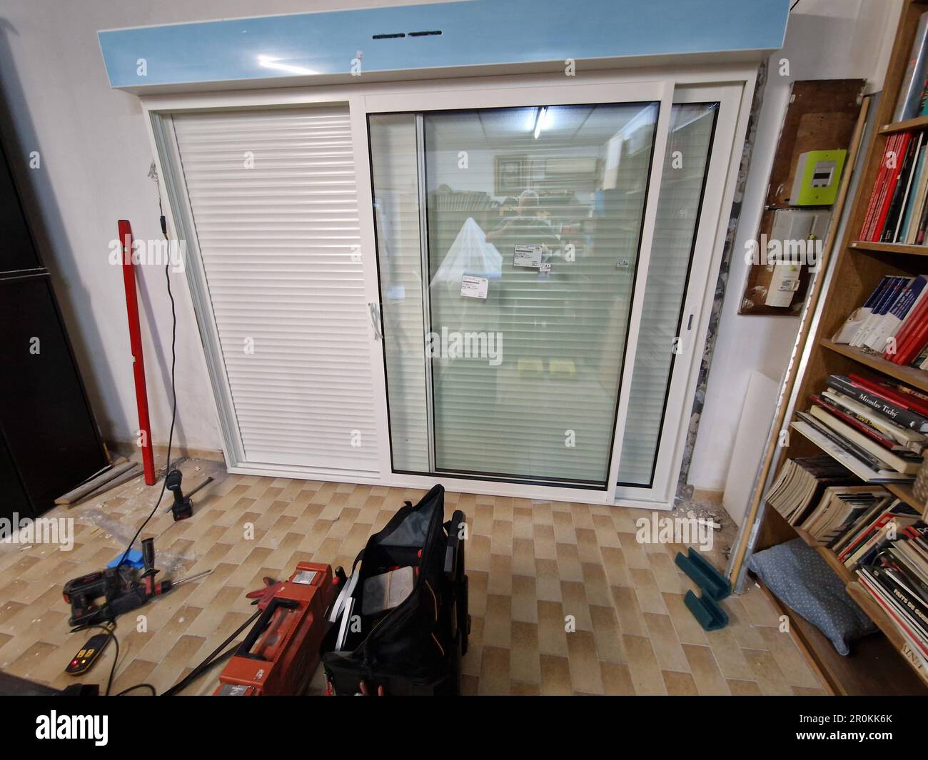 Interior fittings, craftmen setting up a glass window, Bron, France ...
