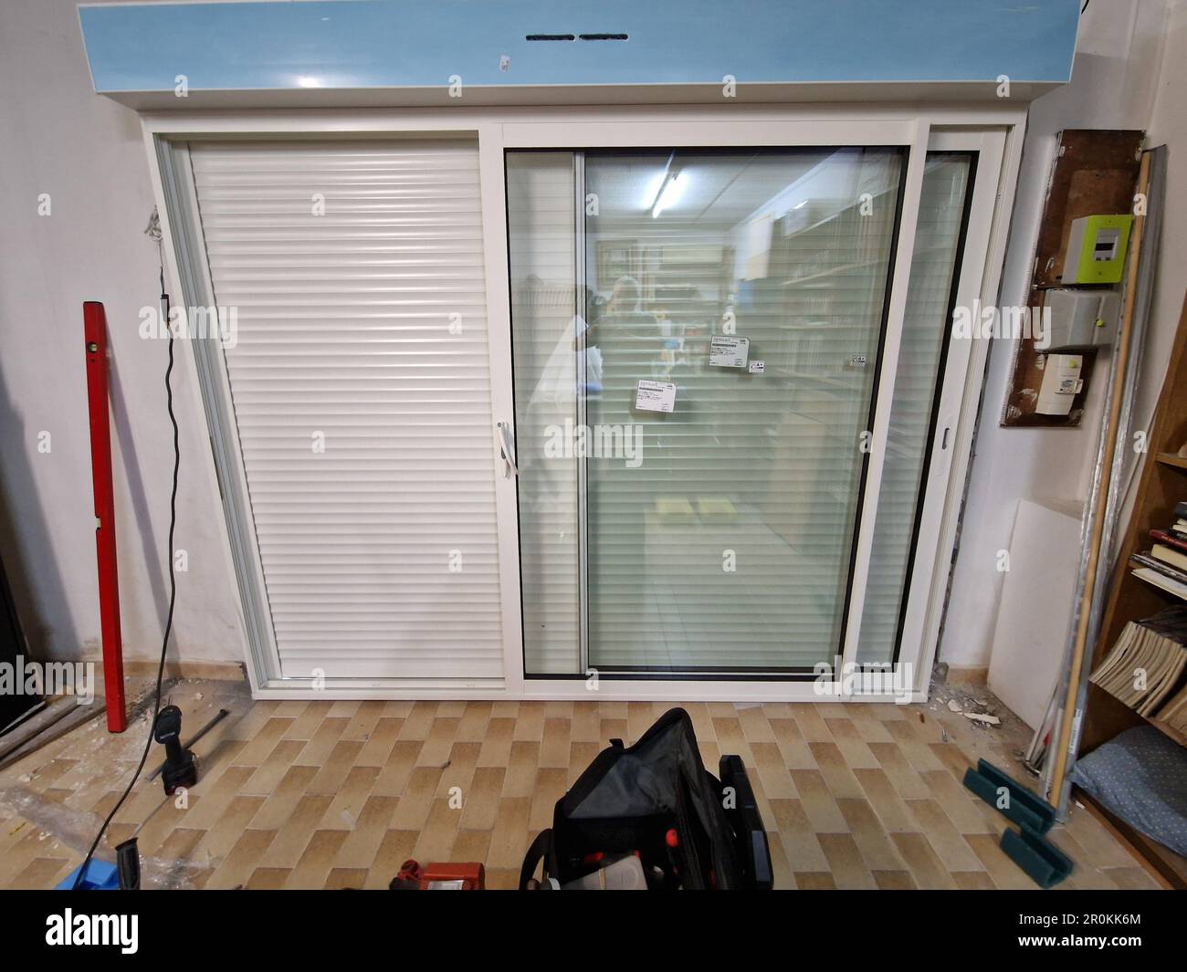 Interior fittings, craftmen setting up a glass window, Bron, France ...