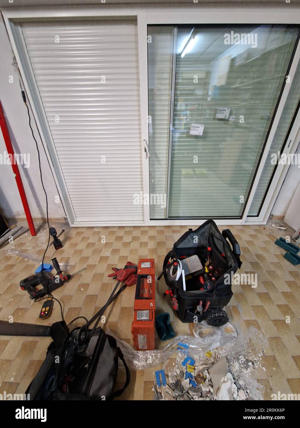Interior fittings, craftmen setting up a glass window, Bron, France ...