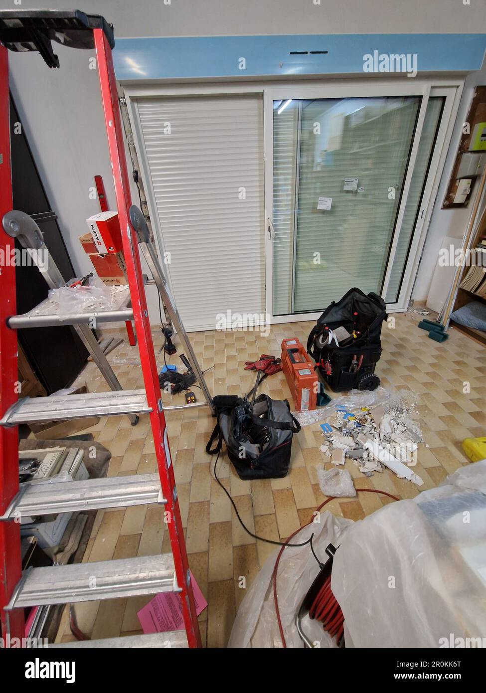 Interior fittings, craftmen setting up a glass window, Bron, France ...