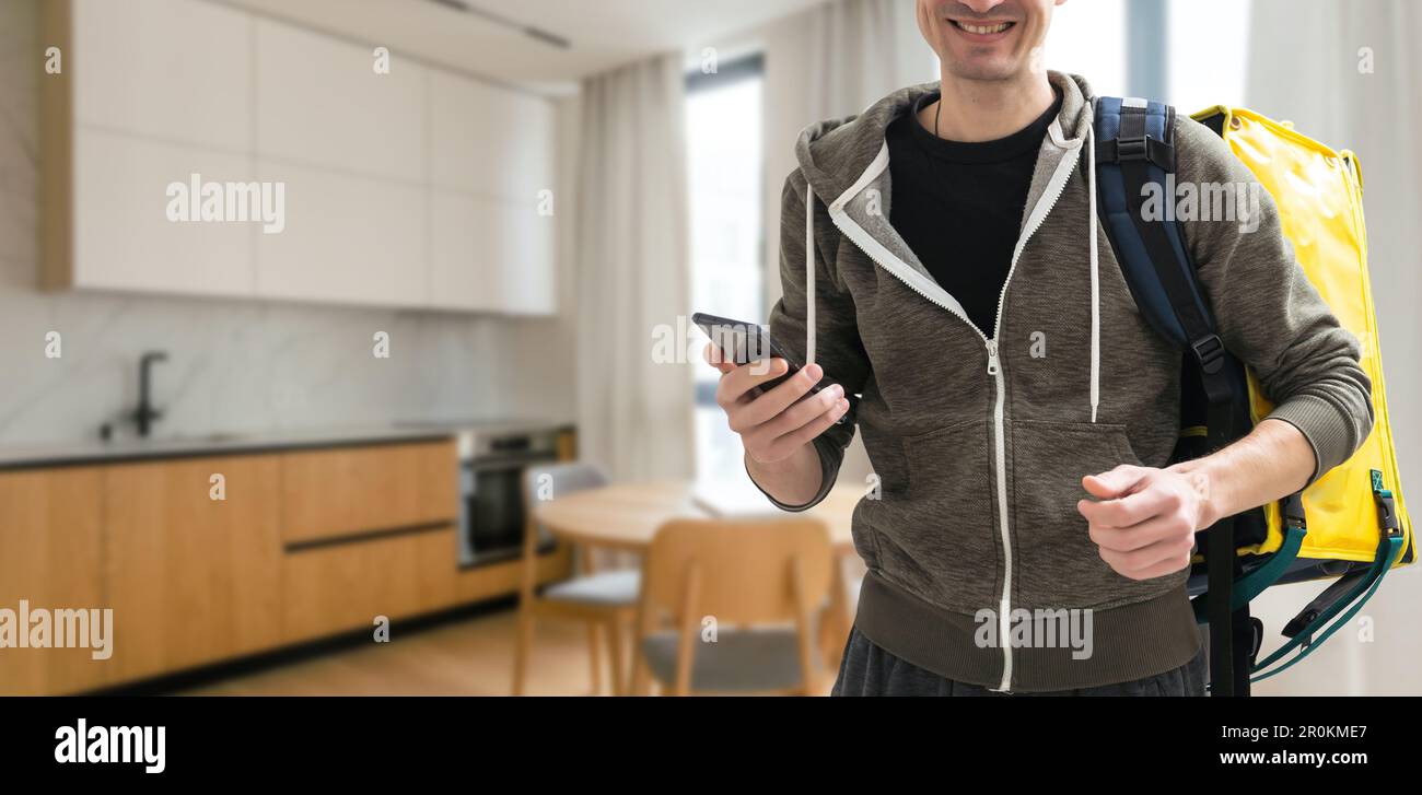 Delivery employee man hold thermal bag backpack with food work as ...