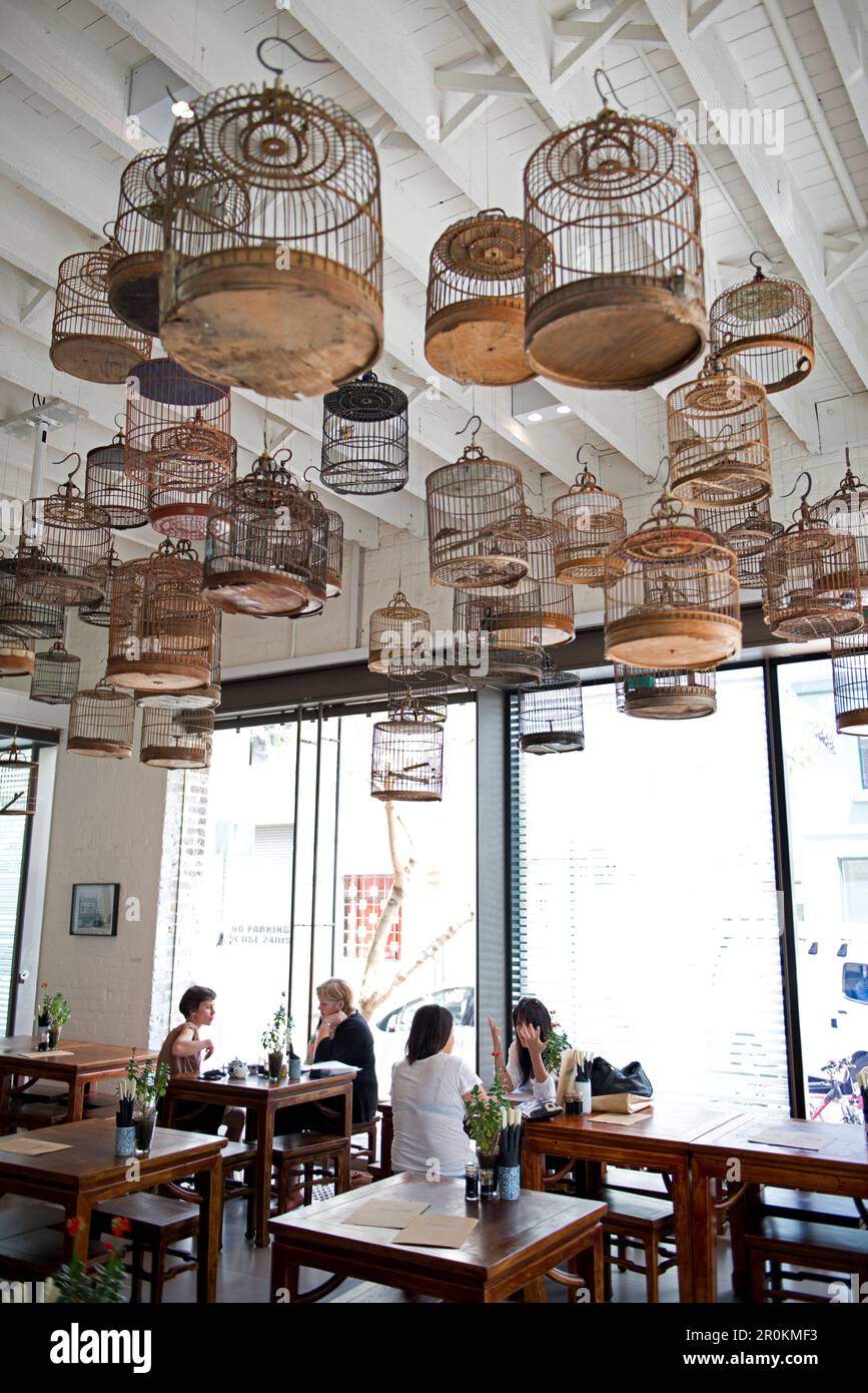 Chinese bird cages decorate the ceiling of the tea house at the White ...
