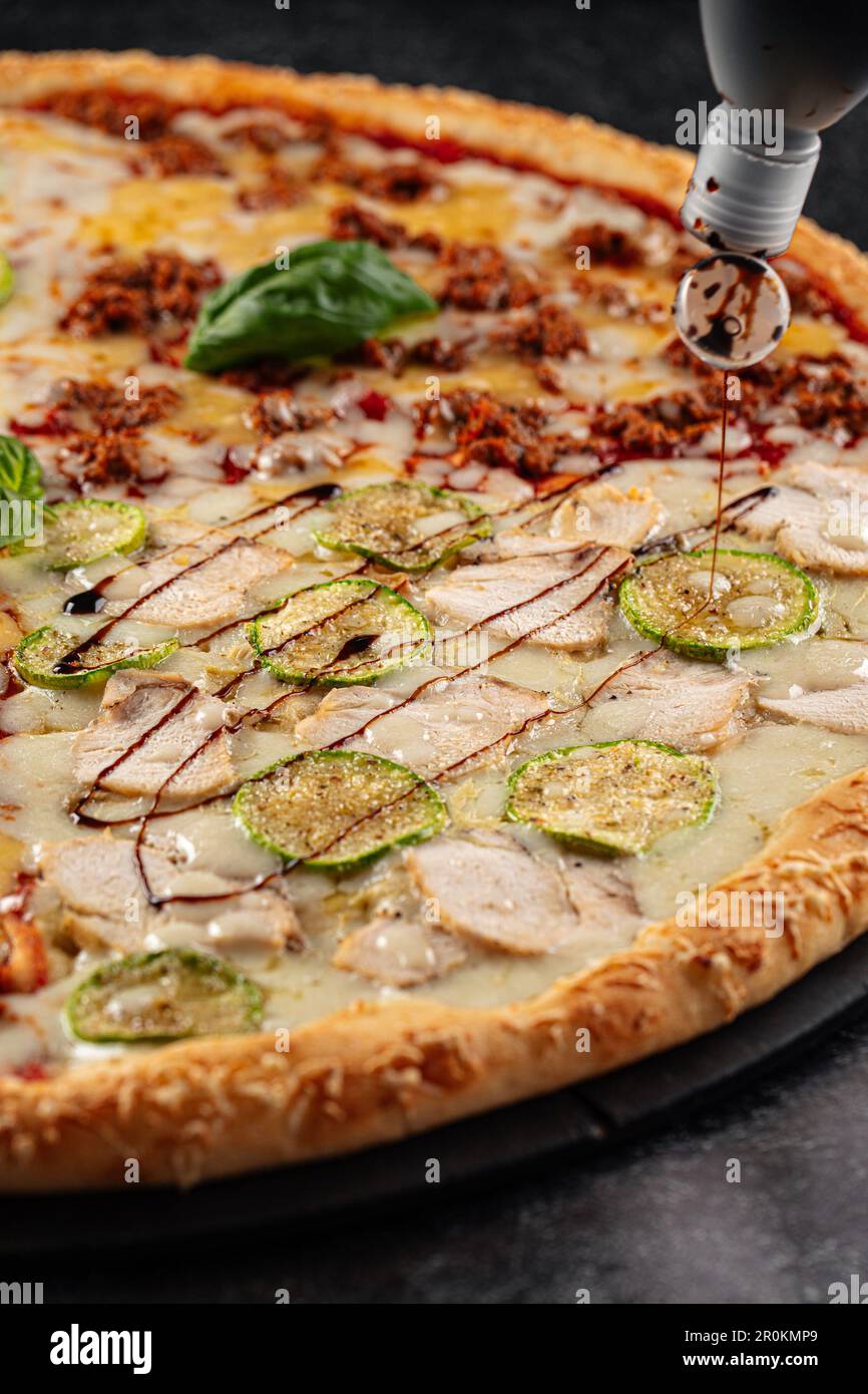 Big assorted pizza with variety of toppings Stock Photo - Alamy