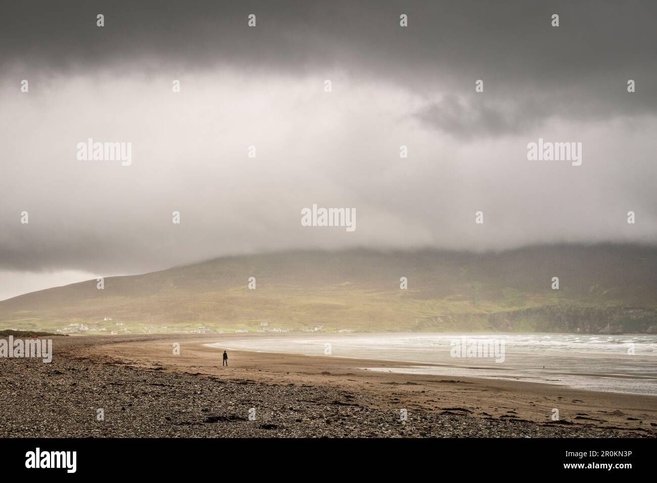 lonesome stroller while raining at Keel Beach, Achill Island, County ...