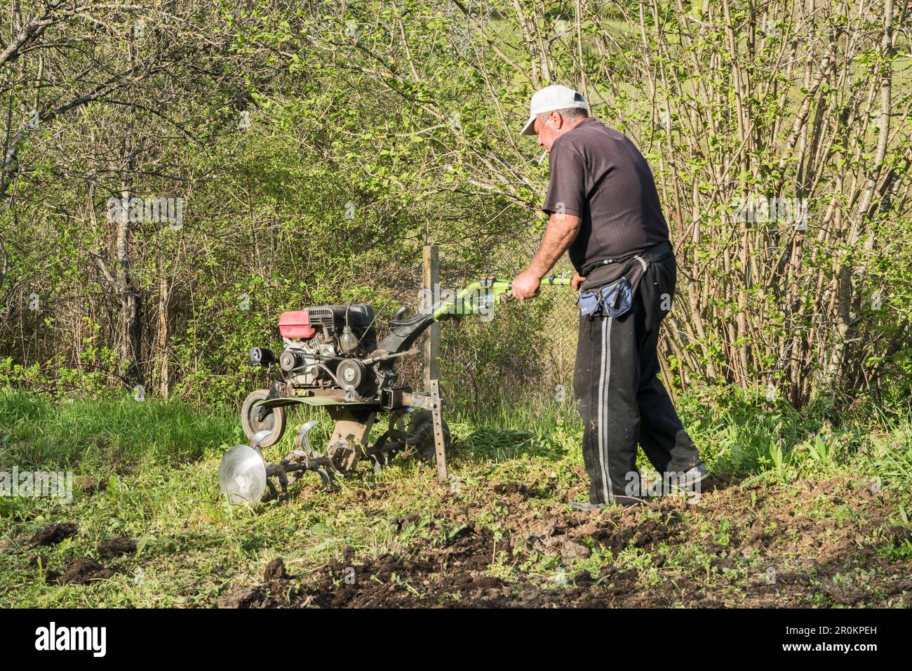 Man plowing garden soil motor hi-res stock photography and images - Alamy