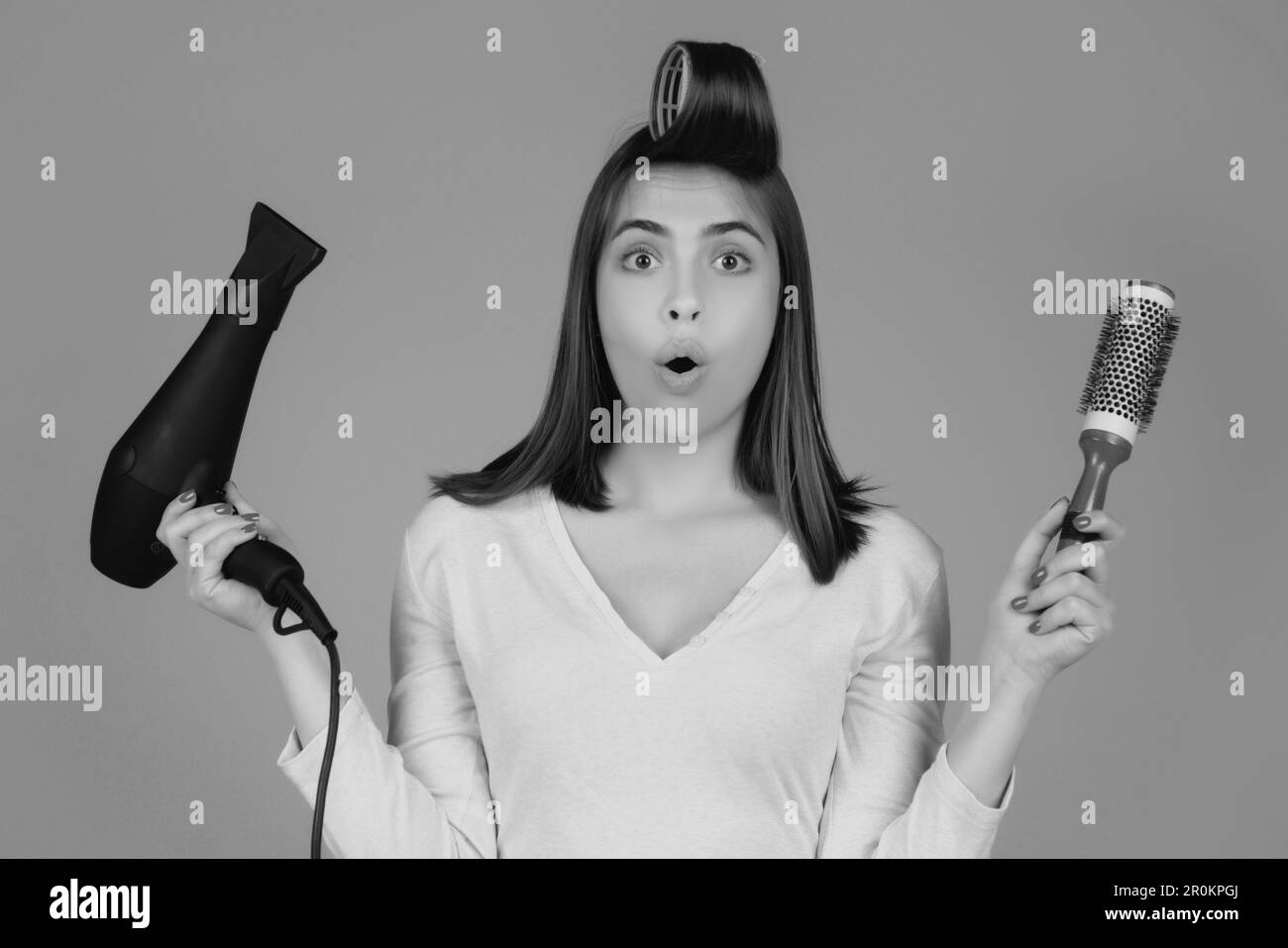 Funny woman combing hair. Beautiful girl with hair comb combs hair ...