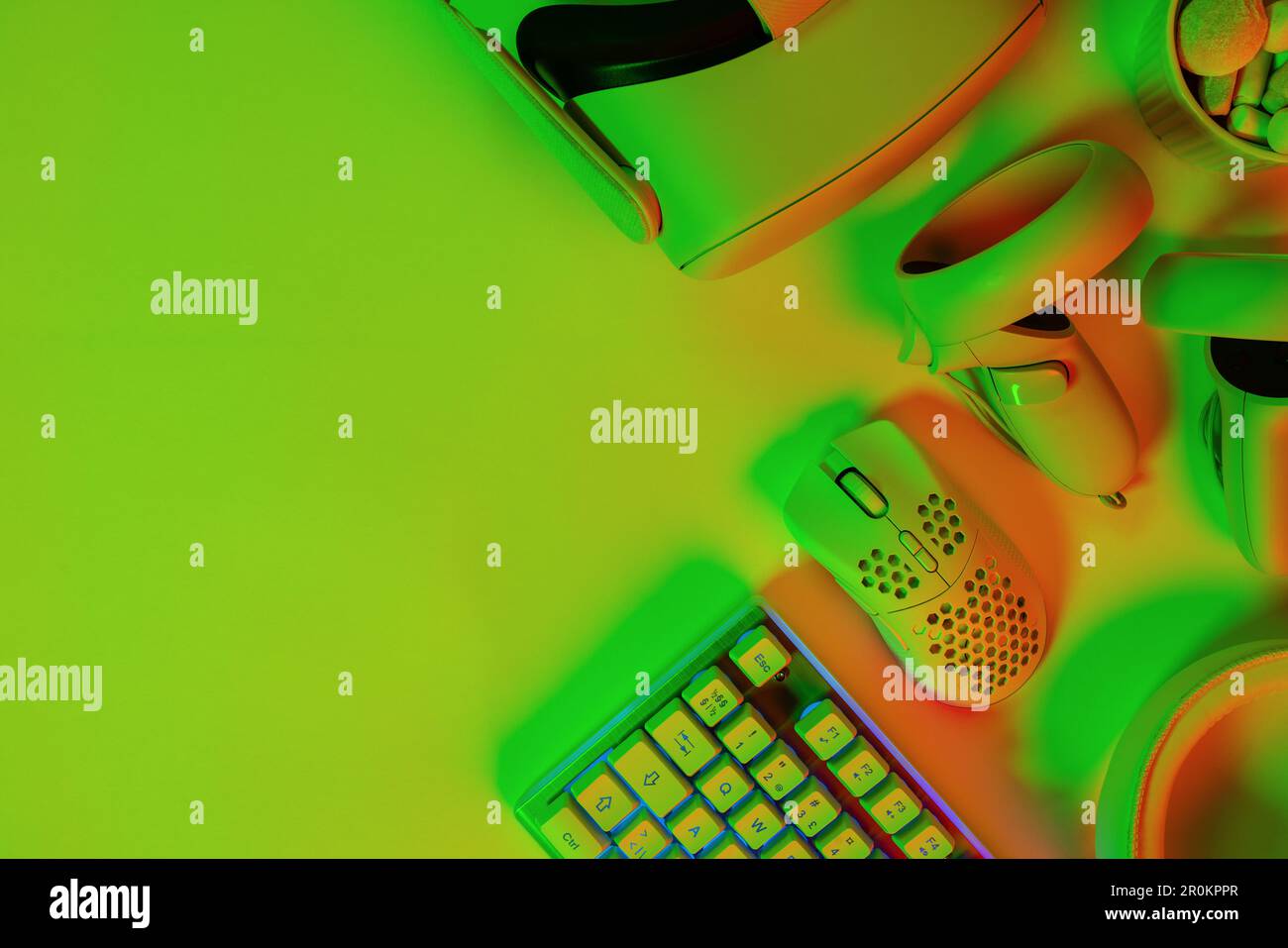 Modern gaming accessories on green desk Stock Photo - Alamy