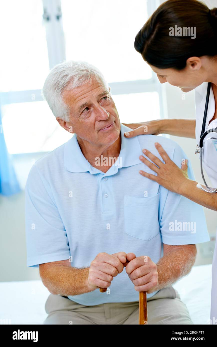 Doctor and patient consultation cane hi-res stock photography and ...