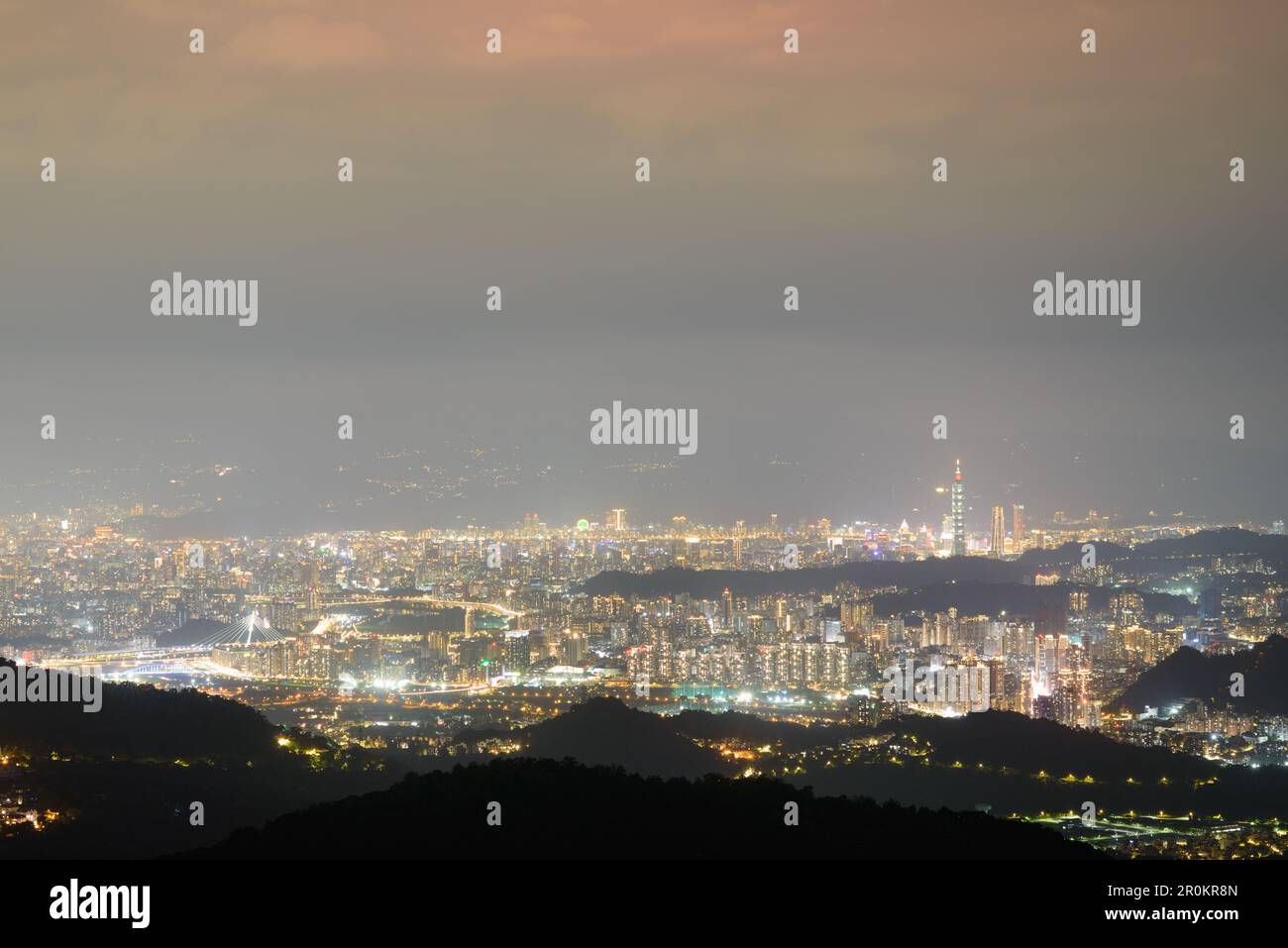 A dark night with bright lights of the city. The night view of Taipei ...