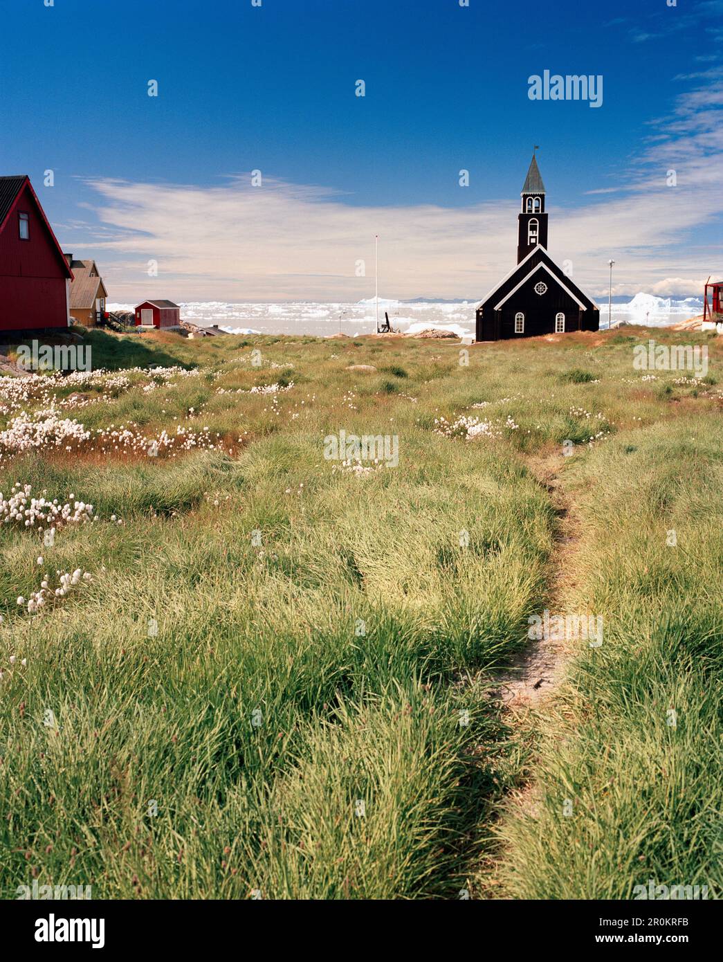 GREENLAND, Ilulissat, Disco Bay, exterior of church with field Stock ...