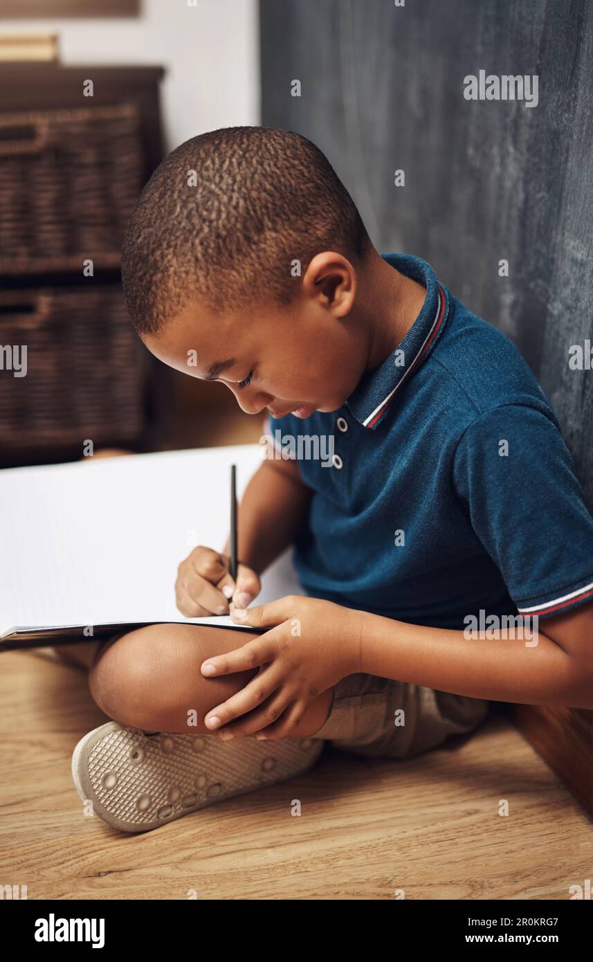 Writing gives children the freedom to explore who they are. a young boy ...