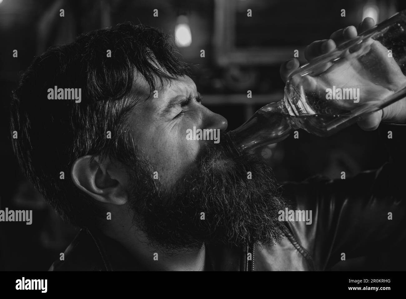 Upset man drinker alcoholic with glass drinking whiskey alone, sad ...