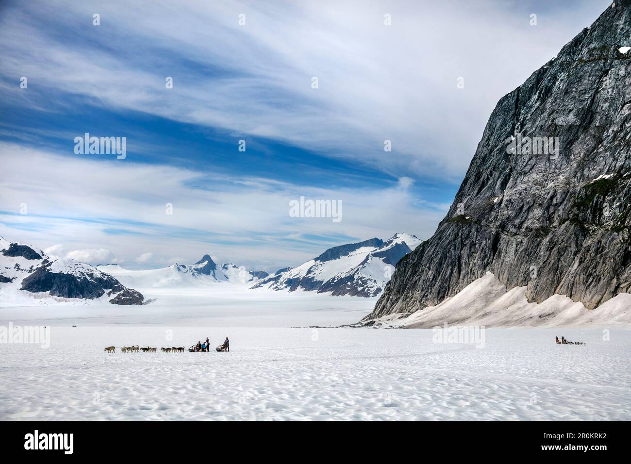 USA, Alaska, Juneau, dogs run below Guardian Mountain on the Juneau Ice ...