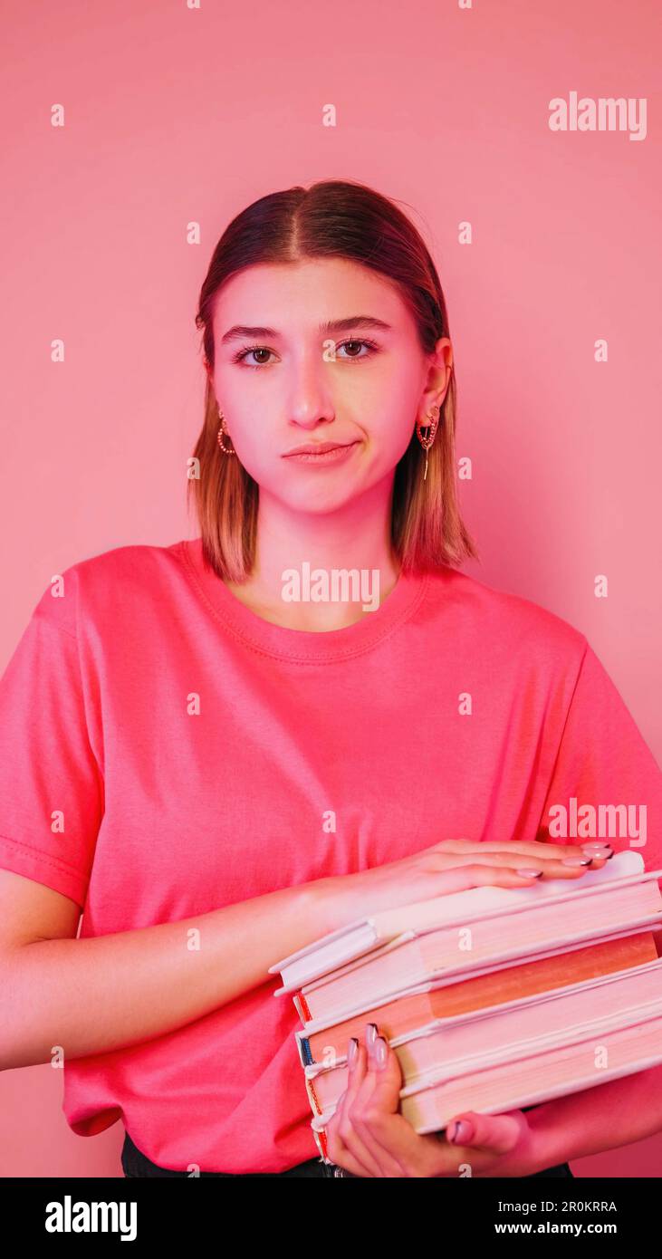 Dissatisfied student reading books hi-res stock photography and images ...