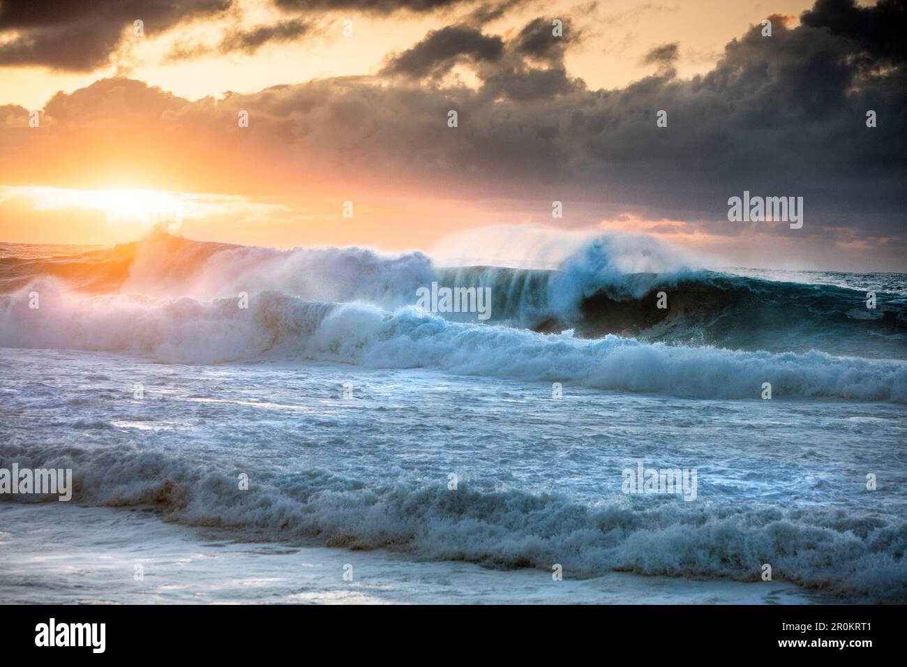 HAWAII, Oahu, North Shore, Big Swell rolling in at sunset at Pupukea ...