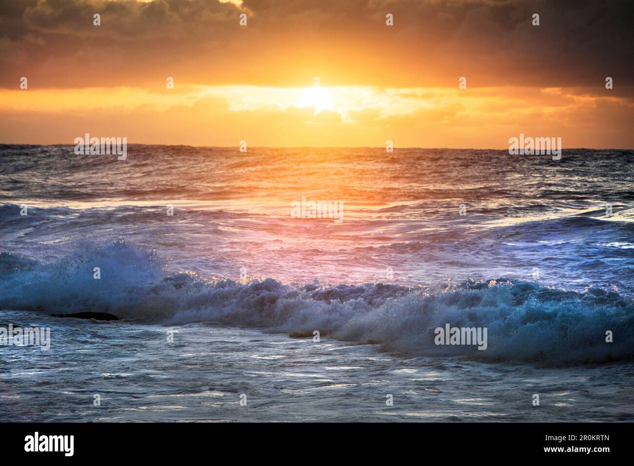 HAWAII, Oahu, North Shore, Big Swell rolling in at sunset at Pupukea ...