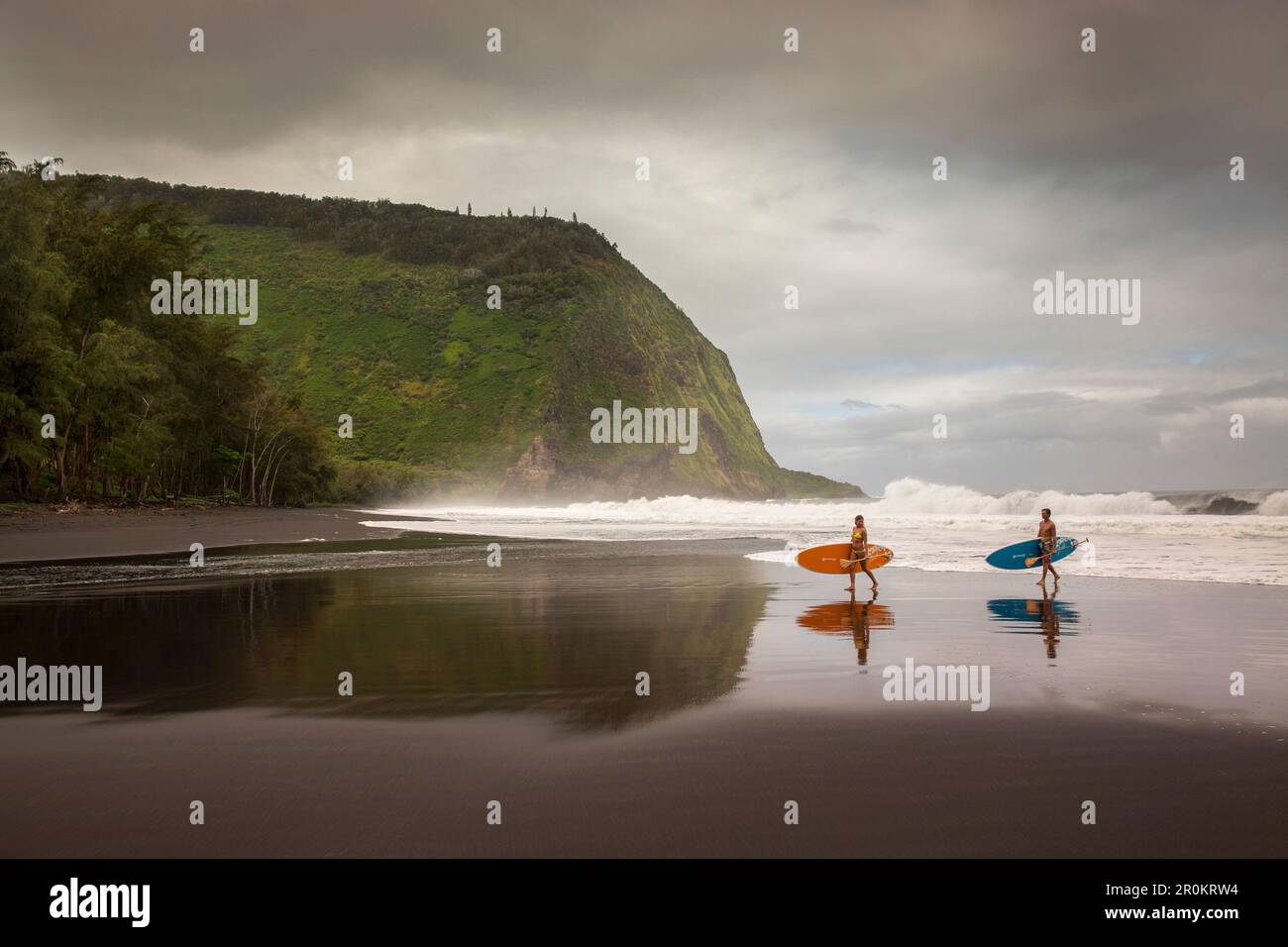 USA, Hawaii, The Big Island, paddle boarders Donica and Abraham Shouse ...