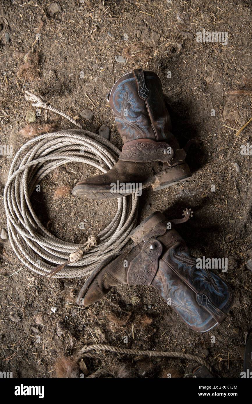 USA, Oregon, Enterprise, the boots and lasso of Cowboy Cody Ross at the ...