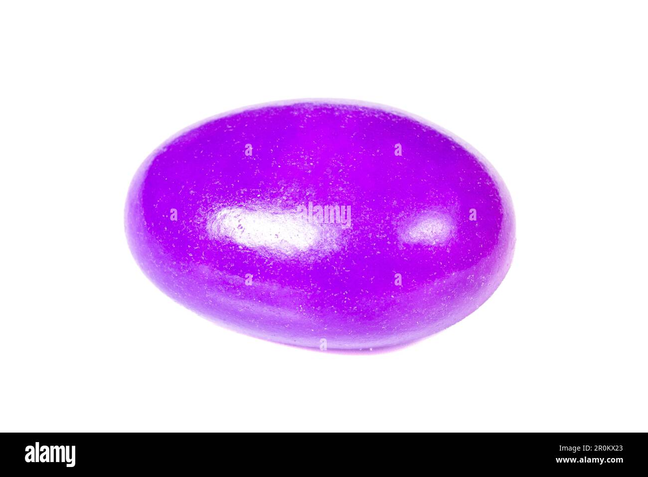 Almond Candies. Chocolate covered purple dragee candy isolated on white ...