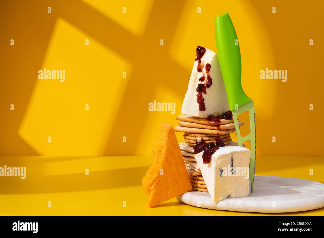 Set or assortment of cheese and crackers. Red stilton, Cambozola, Brie ...